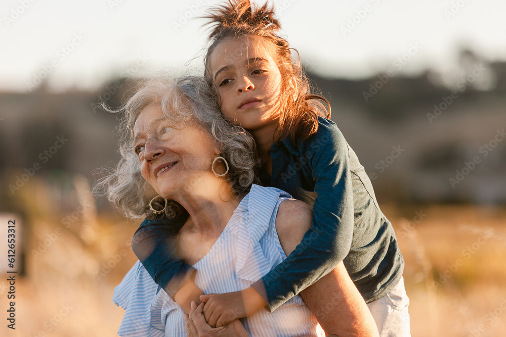 Grandchild hugging his grandmother Stock Photo | Adobe Stock