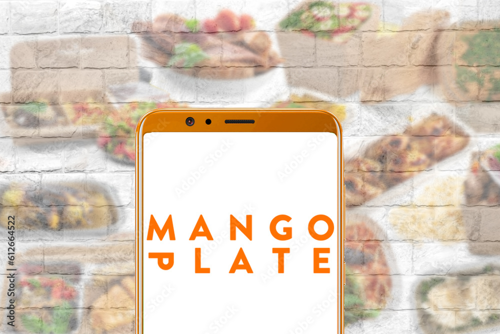 CHENNAI, INDIA 13TH JUNE 2023: Mango Plate logo in holding mobile and ...