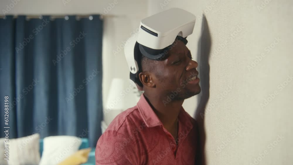 Angry multi ethnic men in VR headsets hit the wall with hands, scream ...