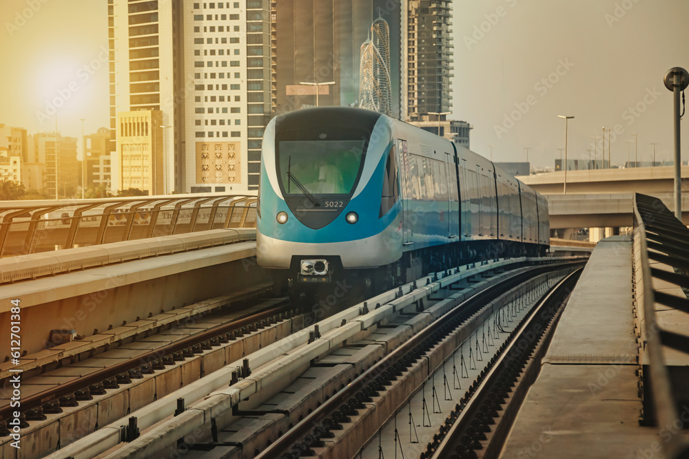 View of train on railroad of Dubai modern subway in downtown at urban ...