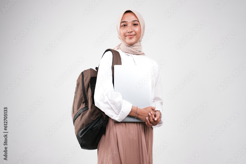 Young muslimah female student is carrying laptop. Prepare back to ...