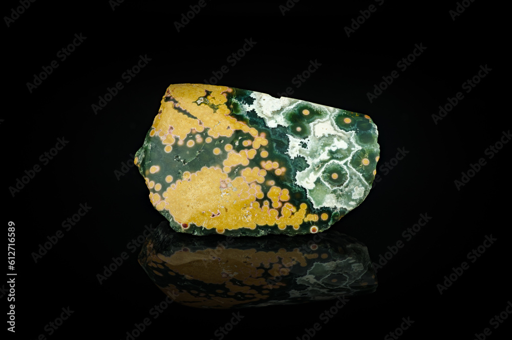 Orbicular jasper (known as ocean jasper) isolated on black background ...