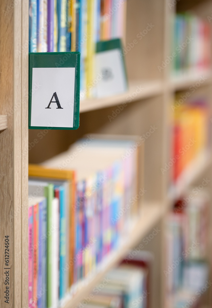 Book shelves with books and catalogue letter in library Stock Photo ...