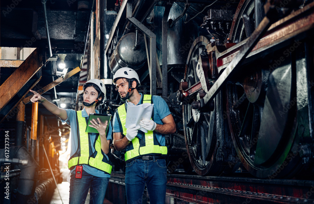 Team of engineer railway wearing safety uniform and helmet under ...