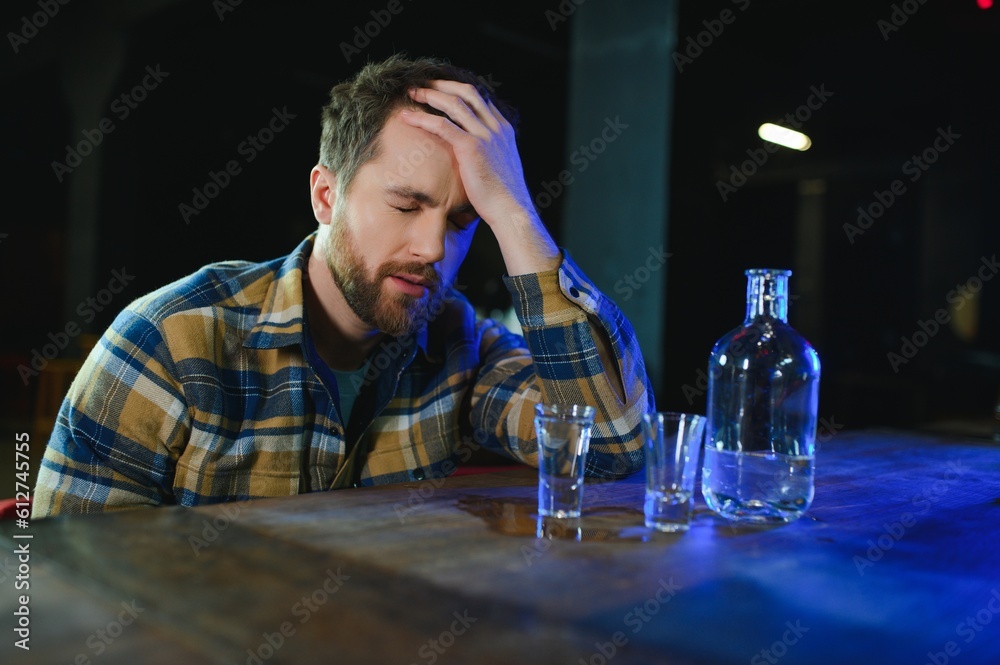 Sad man sitting at bar counter, alcohol addiction Stock Photo | Adobe Stock