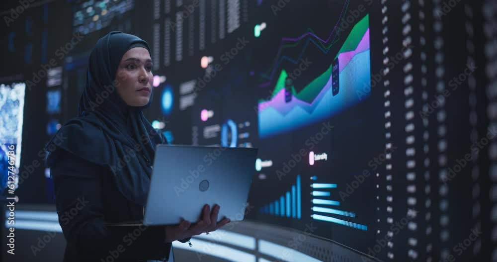Muslim Female Data Center IT Engineer Standing in a Room with an AI ...
