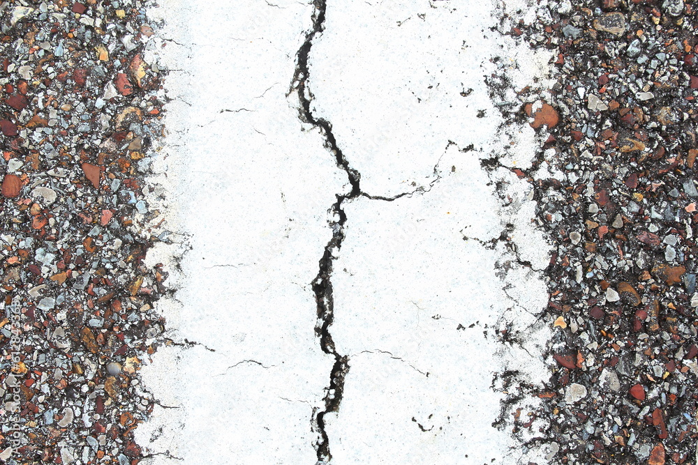 white paint color divider safety line on road,asphalt crack rough ...