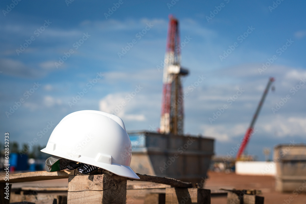 An oilfield worker safety hardhat or helmet is placed at onshore ...