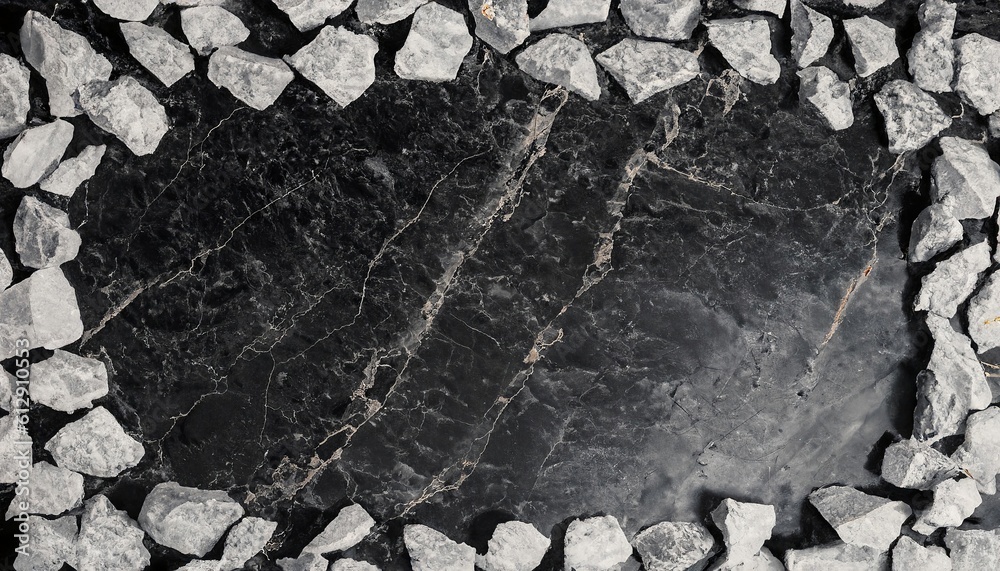 Dark marble texture with stones around, top view, background for ...
