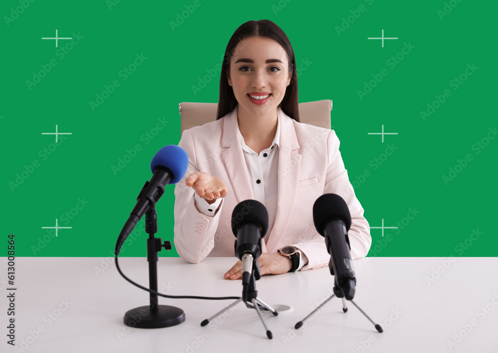 Chroma key compositing. Woman giving interview during news conference ...