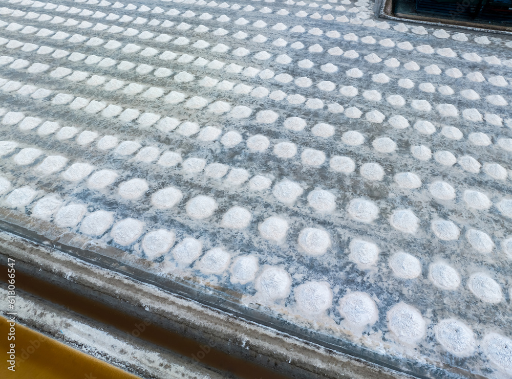 Aerial top view sea salt farm. Pile of brine salt. Raw material of salt ...