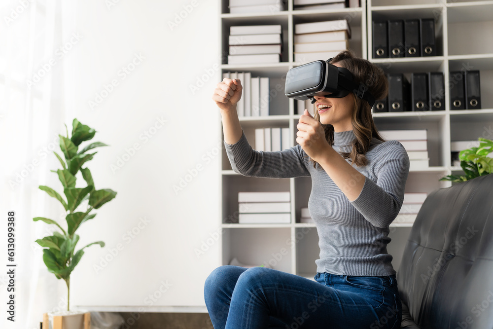Foto de Surprised young latin woman in VR headset touching the air. Smiling caucasian woman ...