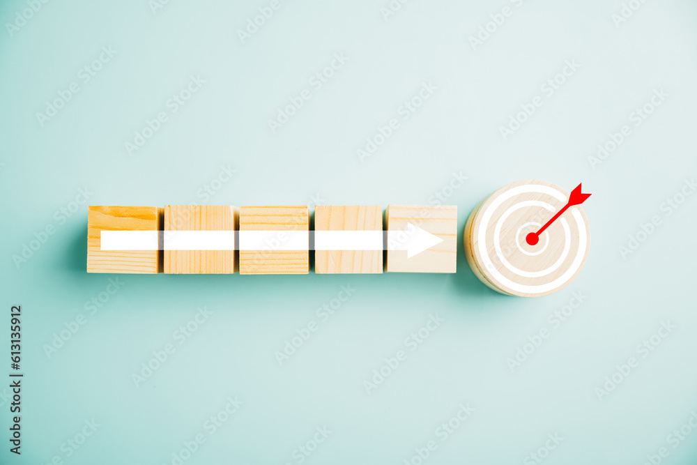 Target icon integrated into wooden blocks with upward arrows, progress ...