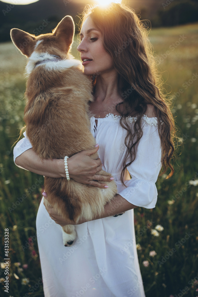 Beautiful woman with a dog in nature Stock Photo | Adobe Stock