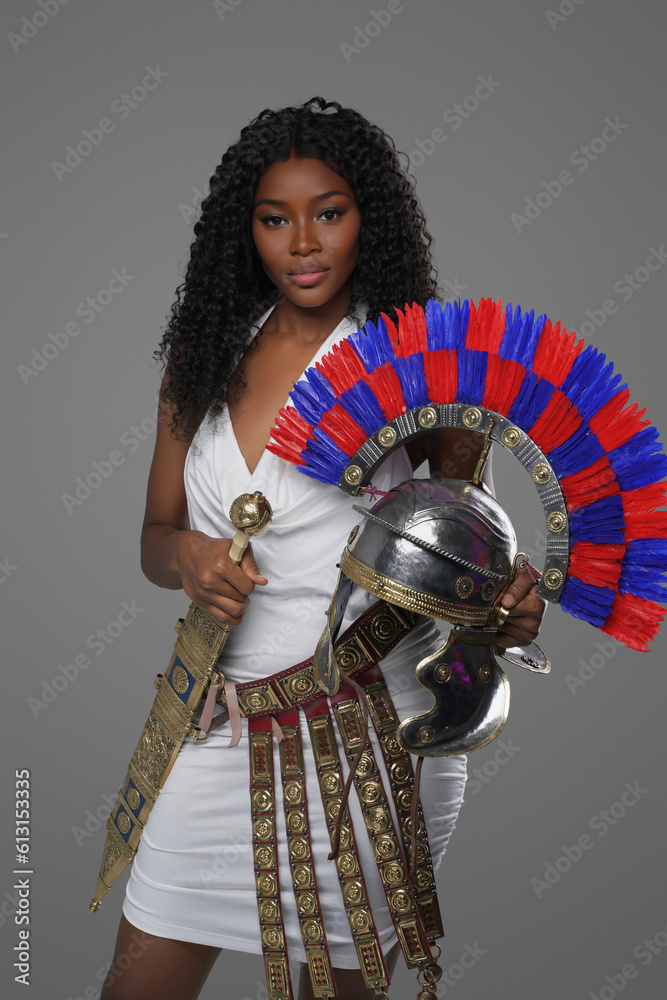 Beautiful dark-skinned model dons a white Roman tunic with a decorated ...
