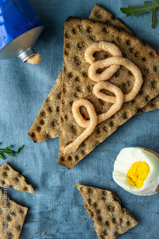 Swedish crisp bread with a strip of cod roe paste (smorgaskaviar ...
