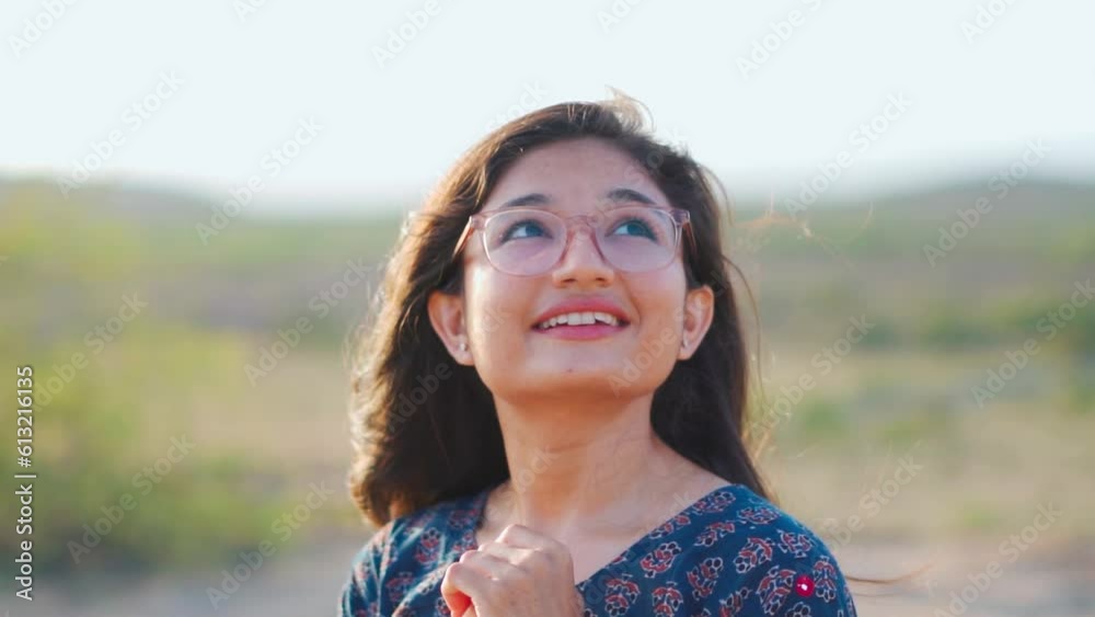 Portrait of beautiful Indian girl looking at the sky. Concept of HOPE ...