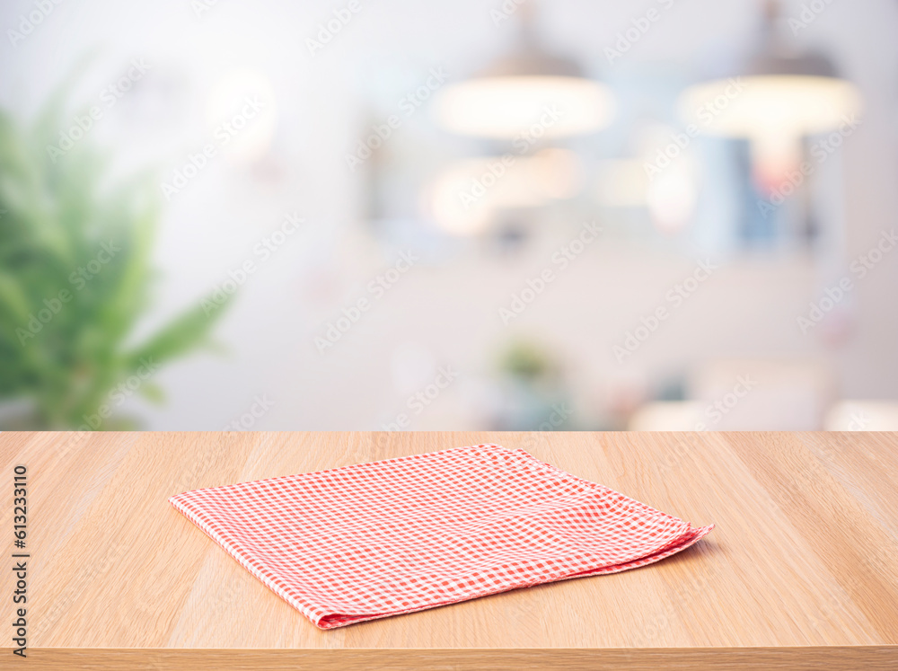 Red fabric,cloth on wood table top on blur kitchen counter (room ...