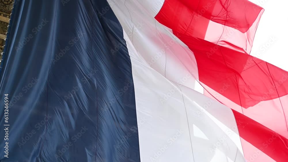 Slow motion of flag of France waving in the wind. French flag on Arc de ...