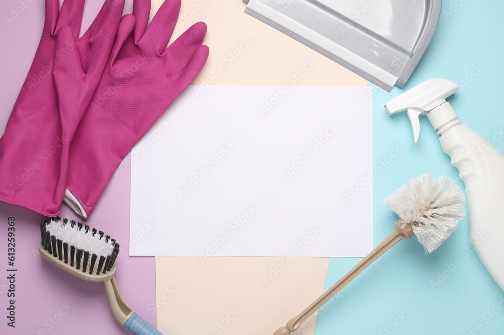 White blank sheet of paper and house cleaning equipment on a pastel ...