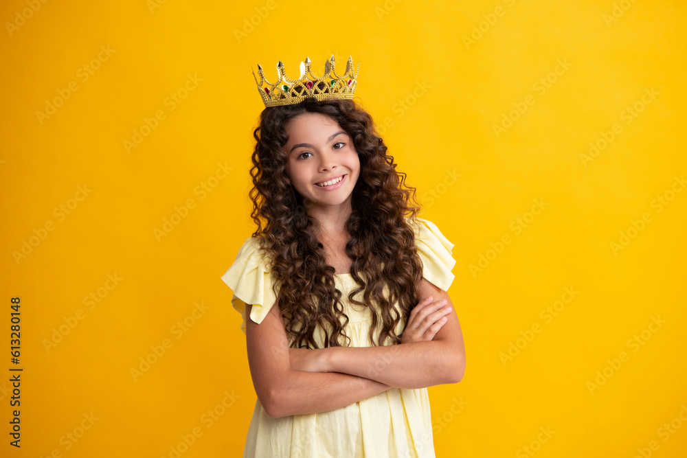 Little queen wearing golden crown. Teenage girl princess holding crown ...