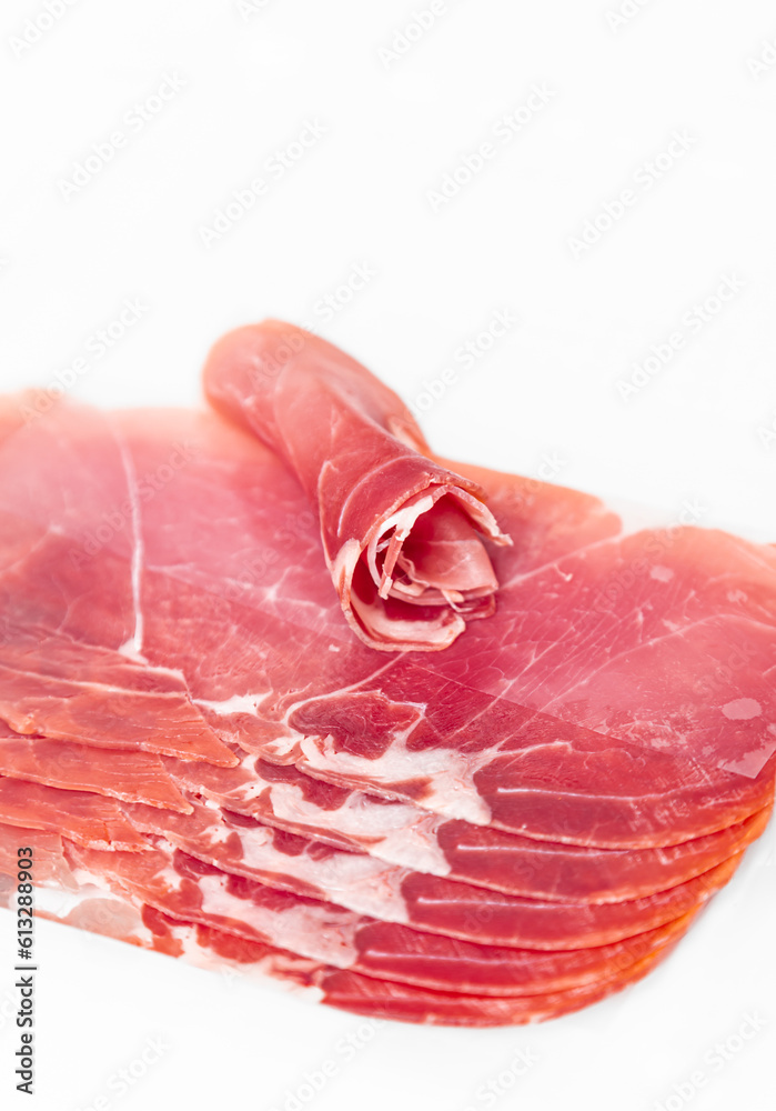 Tasty fresh slices of sun dried jamon serrano meat. Tasty ham snack cut ...