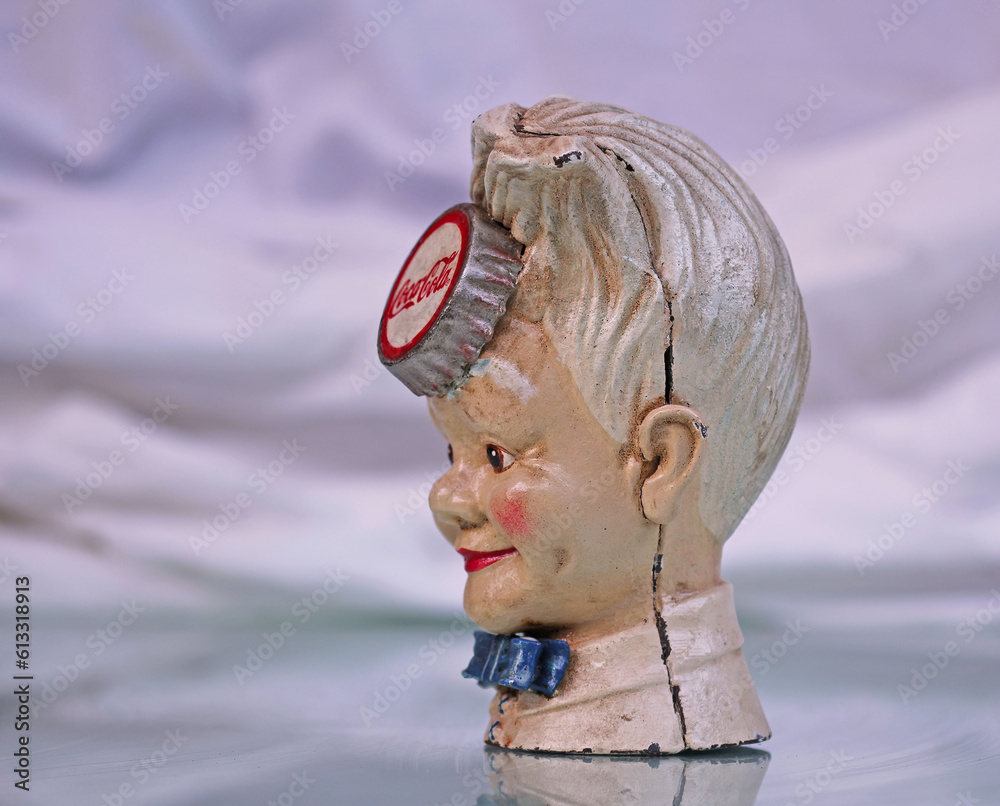 Sydney, NSW Australia - April 9 2023: The side of a cast iron Coca-Cola ...