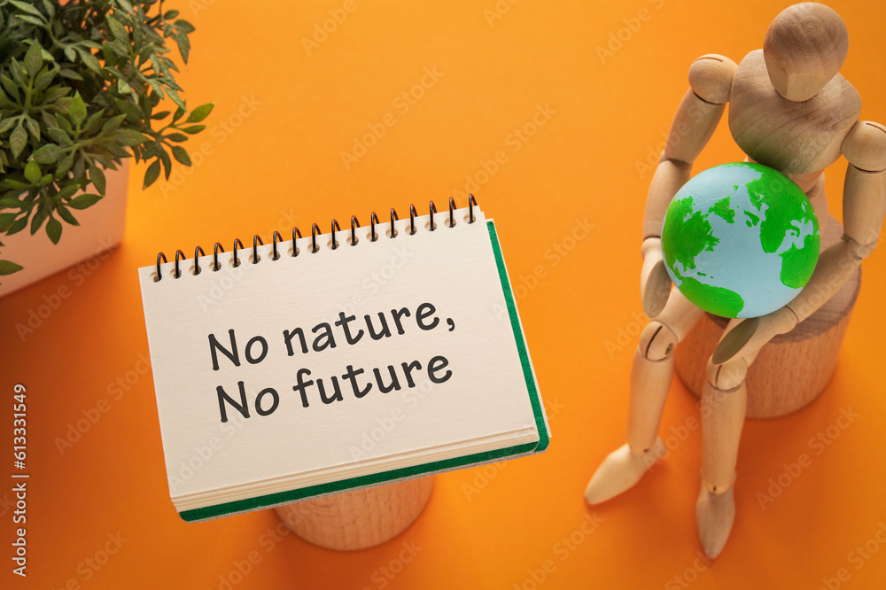 There is notebook with the word No nature, No future. It is as an eye ...