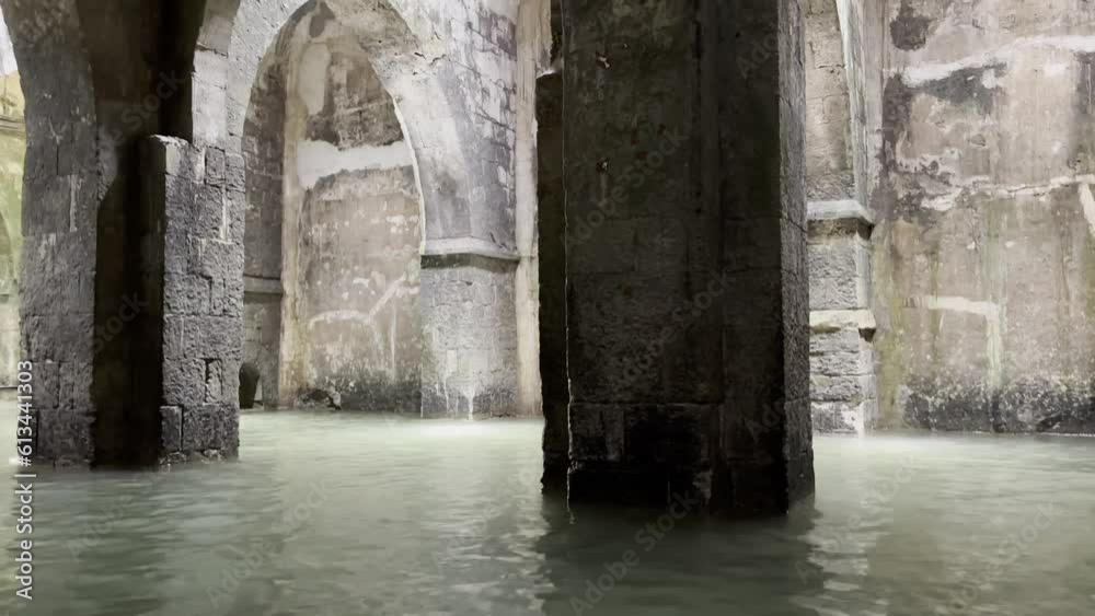 Underground reservoir with water. Columns of ancient stone building ...