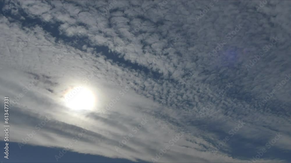 Natural blue sky background with decorative Altocumulus clouds moving ...
