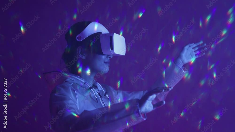 Woman in futuristic costume. Girl in glasses of virtual reality while ...
