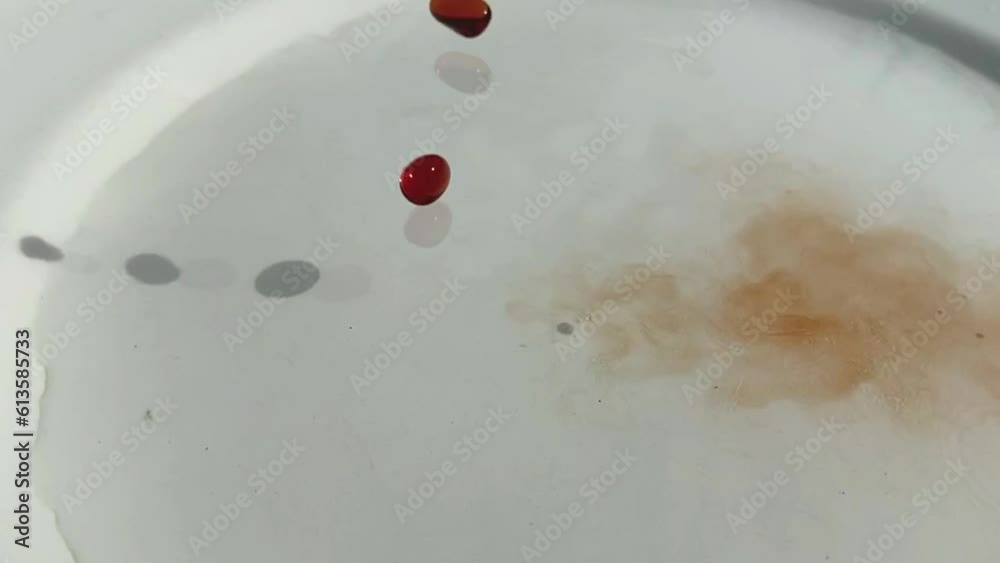 Vidéo Stock red dye dropping into water looking like blood dripping ...