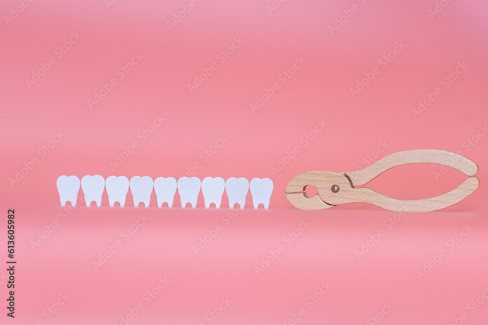 Teeth row and forceps for tooth extraction. Oral health problems and ...