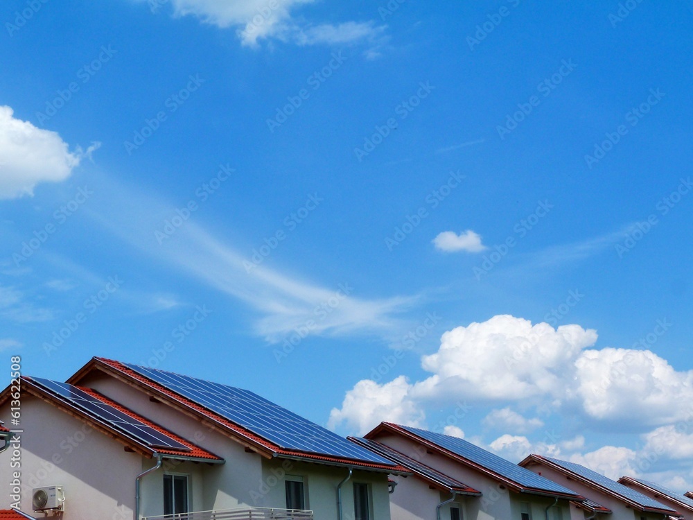 roof installed photovoltaic PV sun collector solar panels. sloped clay ...