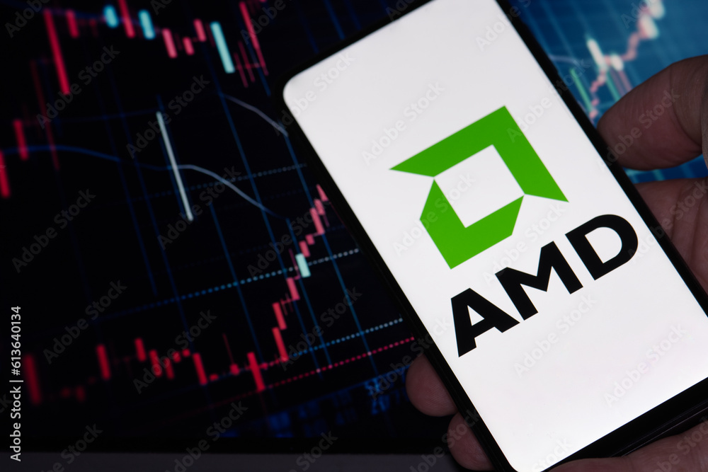 Hand holding AMD, Advanced Micro Devices, Inc., company logo displayed ...