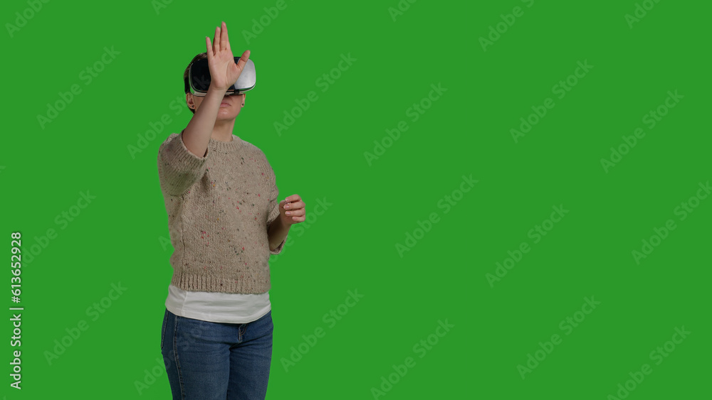 Foto de Side view of female model having fun with vr headset on ...