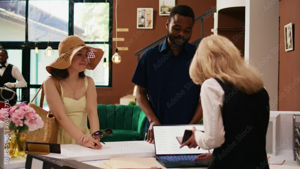 Travellers giving passports at reception, using id papers for ...