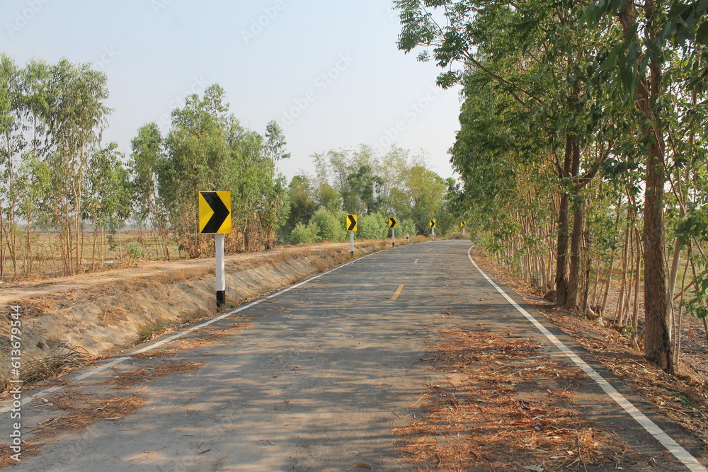Paved road beside a canal without water during the day Stock Photo ...