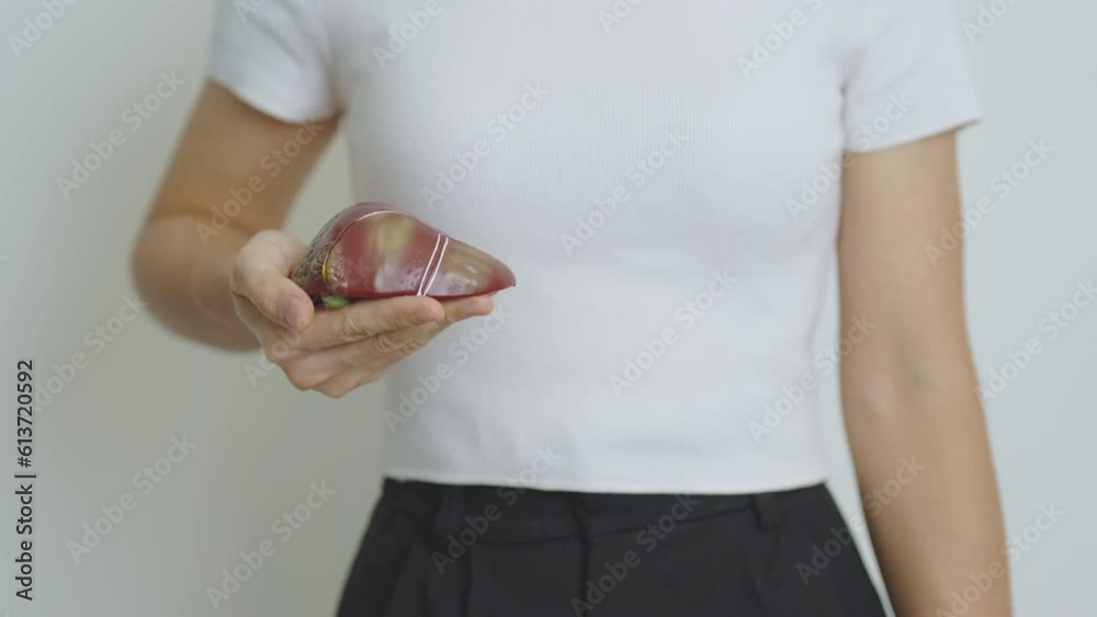 Woman holding human Liver anatomy model. Liver cancer and Tumor ...