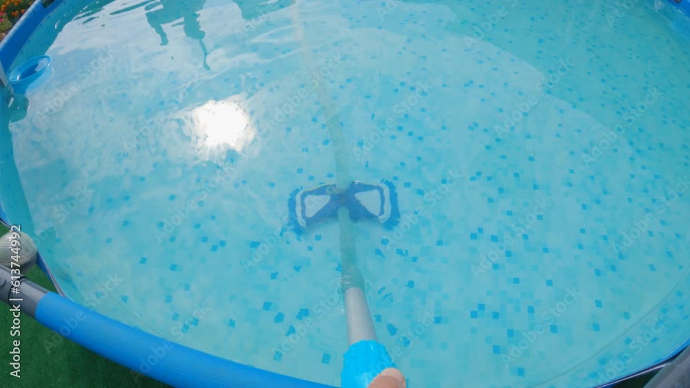 Clean the bottom of the pool with an underwater vacuum cleaner ...