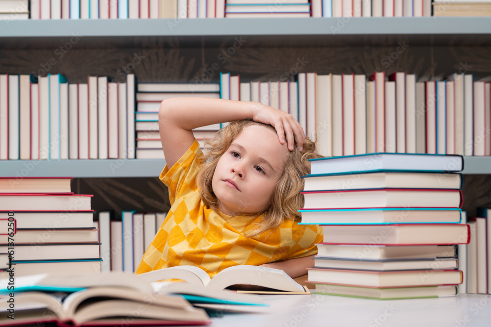 Back to school. Kid on school library. Child reading book at school ...