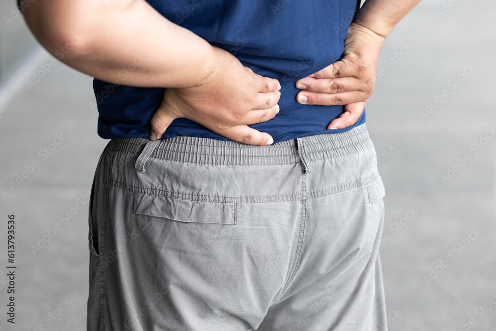 Foto de Middle aged old Asian senior man suffering from lower back pain ...