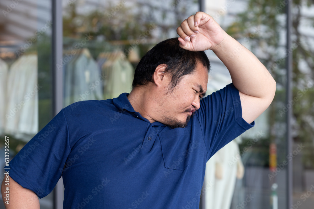 Middle aged old Asian senior man sweating, feeling bad and ...