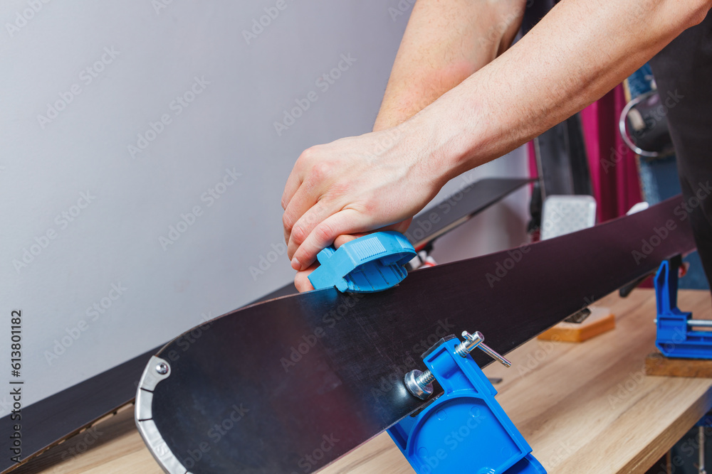 Process of ski sharpening by sharpen tool in vices Stock Photo | Adobe ...