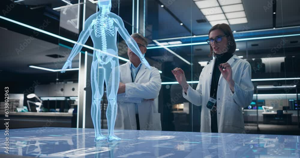 Two Bioengineers Working With Computer-Powered Animated VFX Hologram Of ...