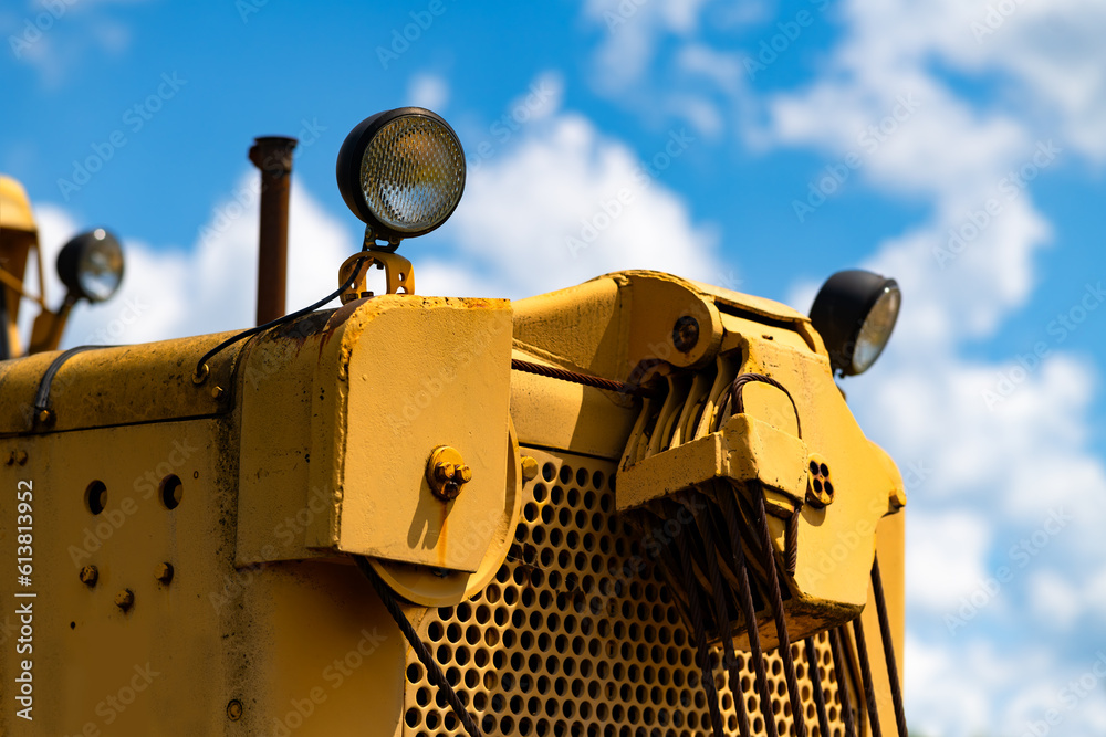 Front radiator grill of a big old yellow bulldozer. Vintage machine ...