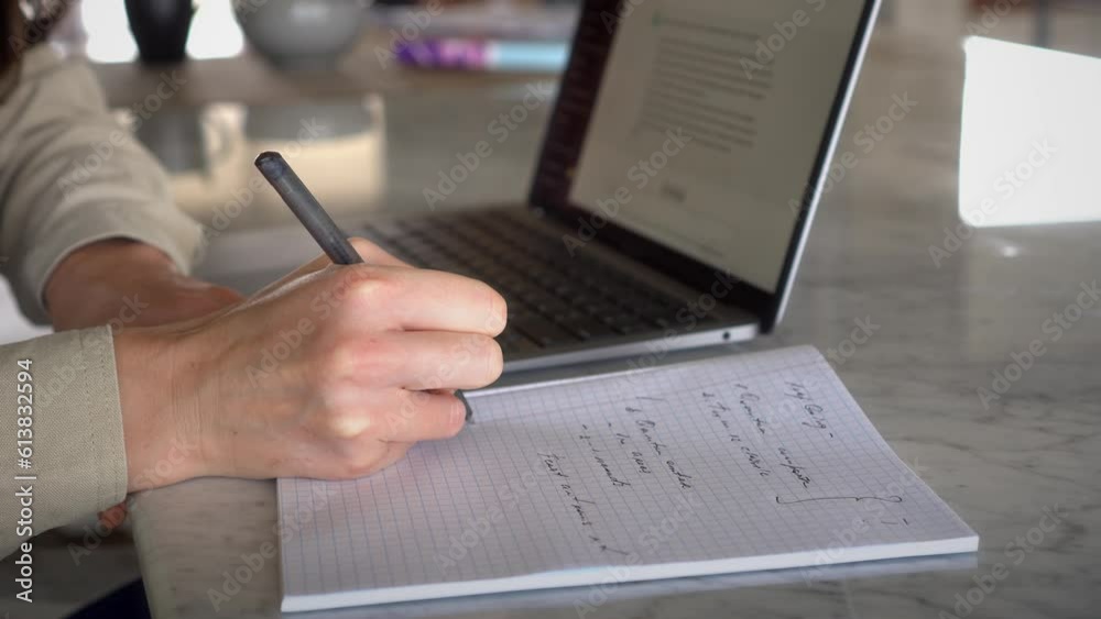 Student using AI chatbot on laptop PC to do homework for school ...