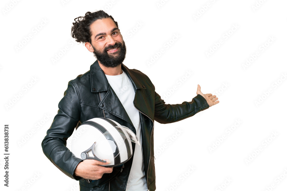 Young man with beard with a motorcycle helmet over isolated chroma key ...