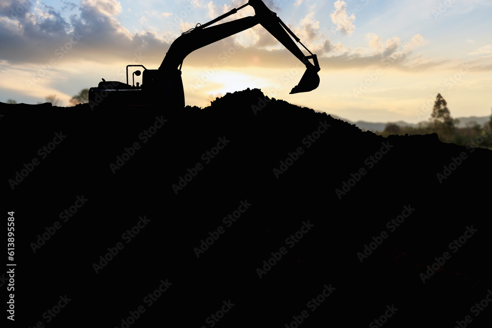Crawler excavators silhouette are digging the soil in the construction ...