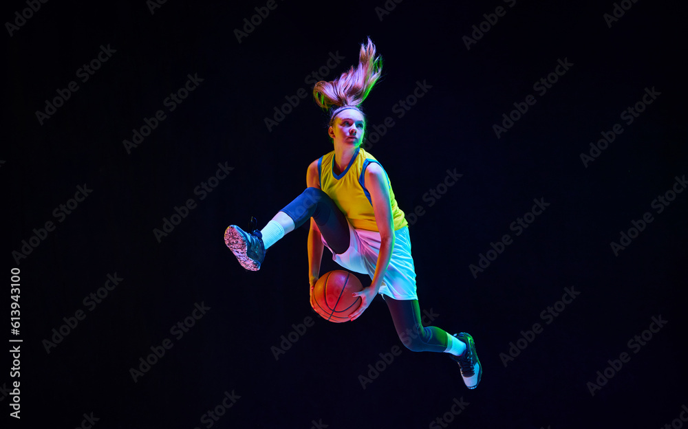Dynamic image of motivated sportsman, young girl playing basketball ...